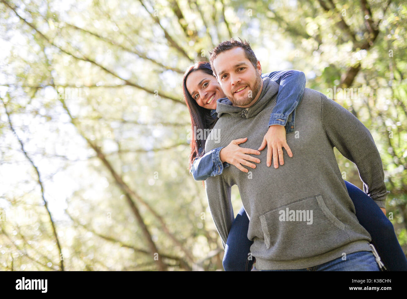 Nice couple having good time in the forest Stock Photo - Alamy