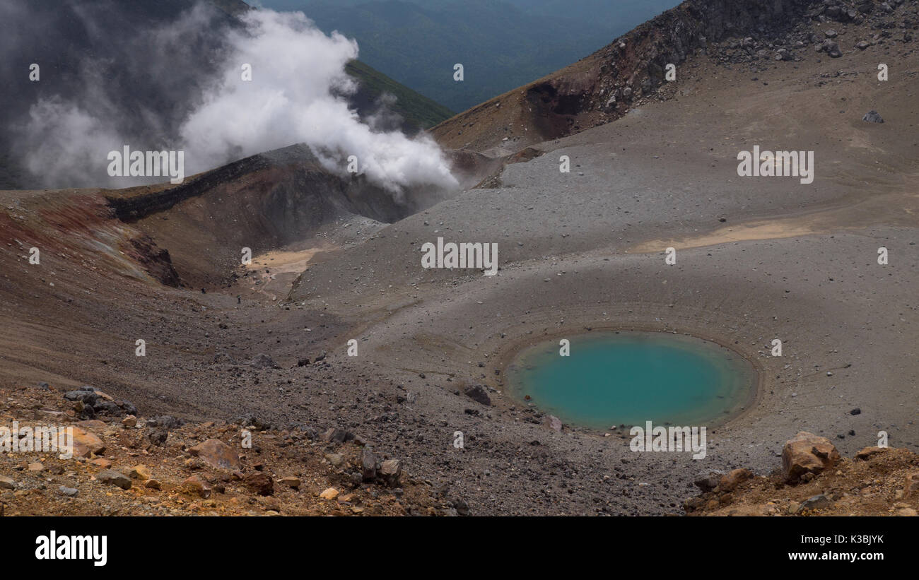 Meakan volcano in Akan National Park, Hokkaido, Japan. White steam vent ...