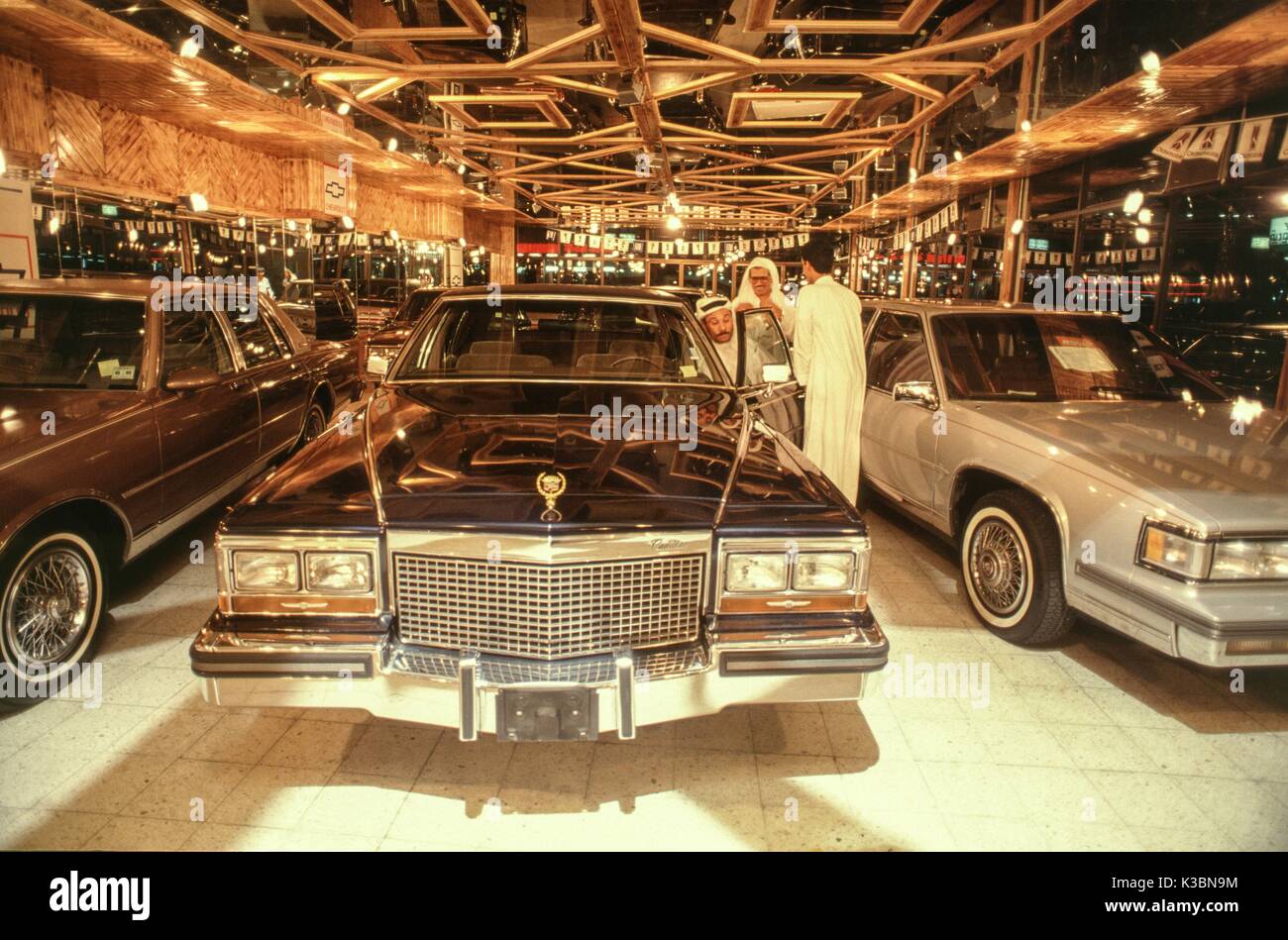 Saudi's shopping for new cars at a General Motors dealer in Jeddah ...