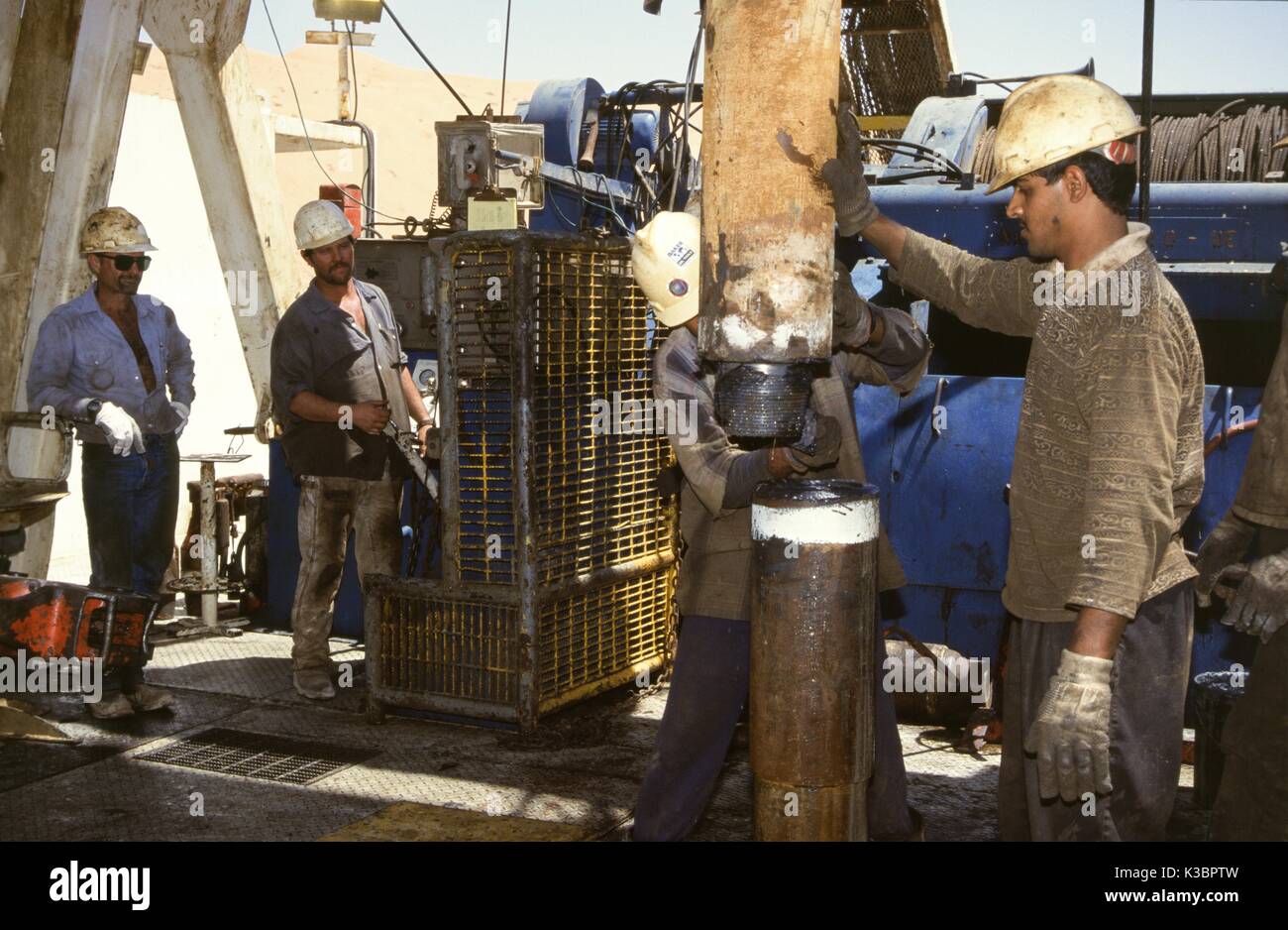 Oil rig drill floor action on an oil and gas exploration rig in the ...