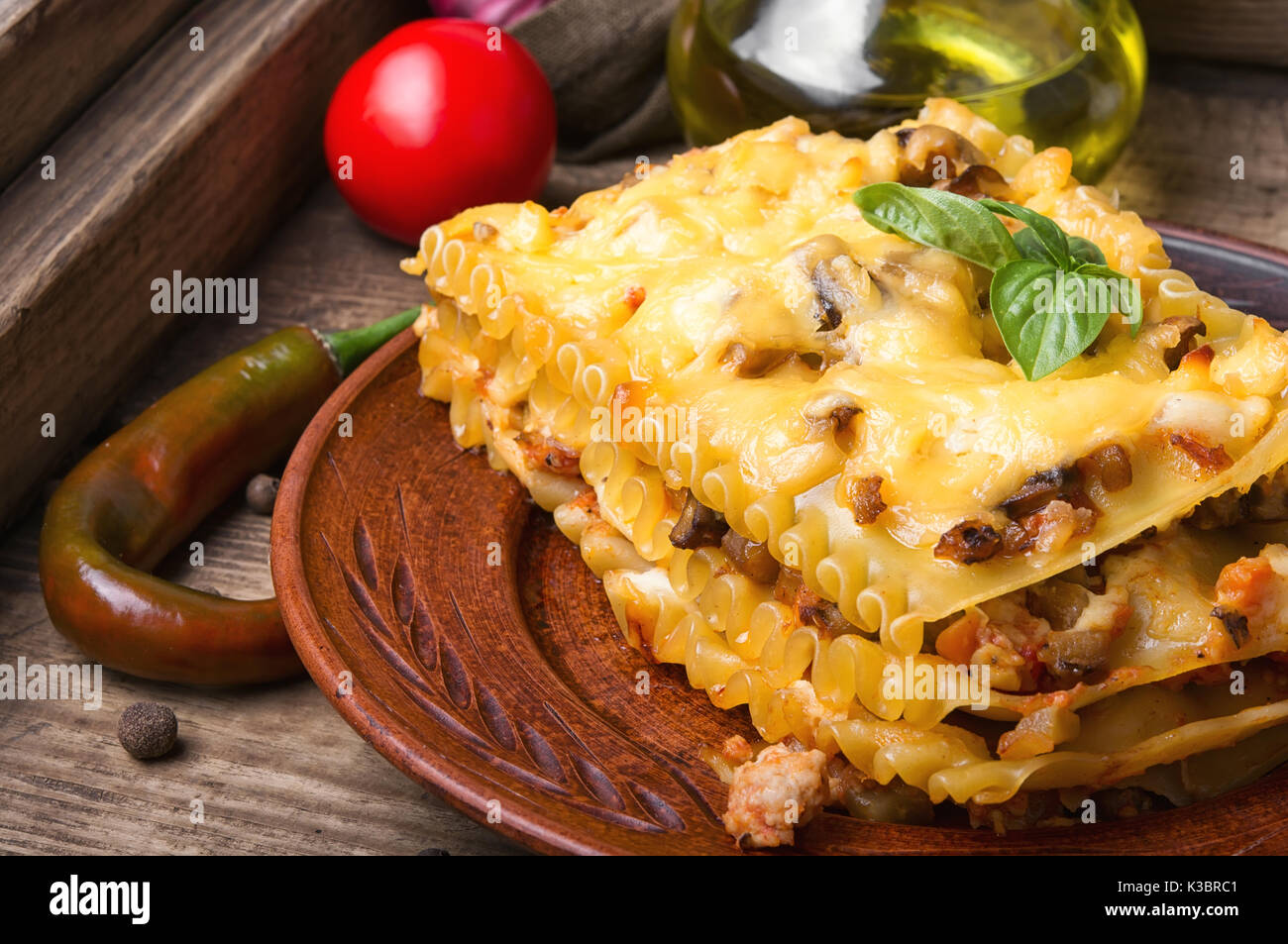 Traditional italian lasagna on wooden rustic background Stock Photo - Alamy