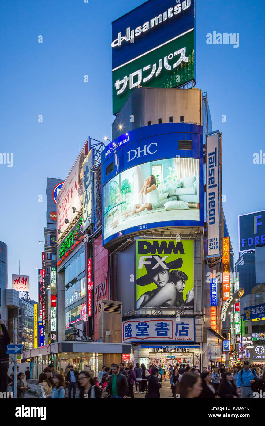 The bright lights of Shibuya Crossing at night in the Shibuya district ...