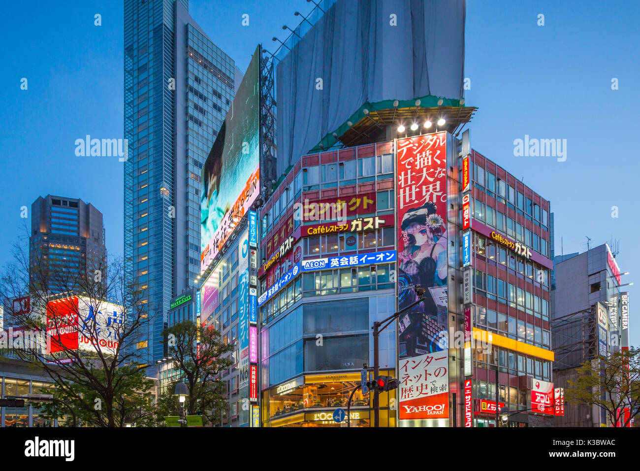 The bright lights of Shibuya Crossing at night in the Shibuya district ...
