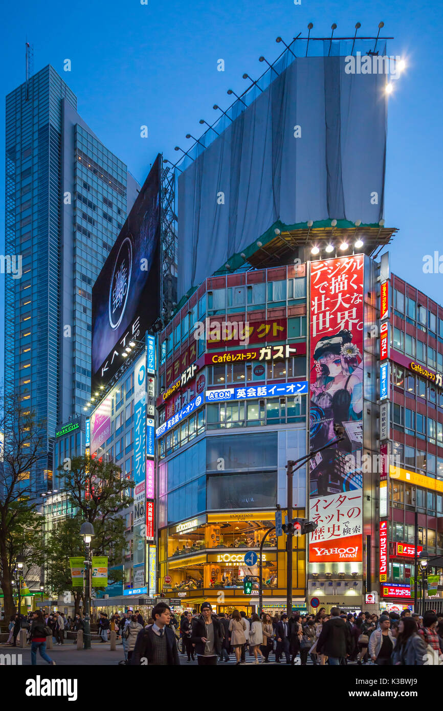 The bright lights of Shibuya Crossing at night in the Shibuya district ...