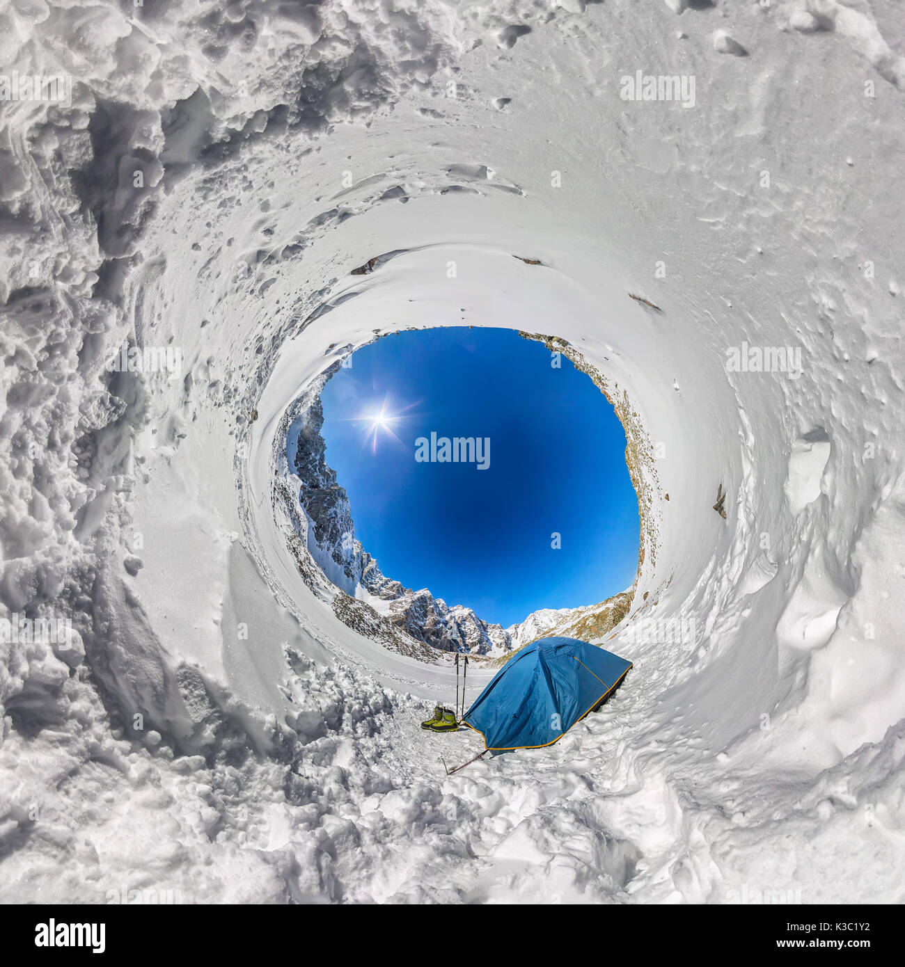 Blue tent in the snowy peaks of the mountains. A spherical 360 180 ...