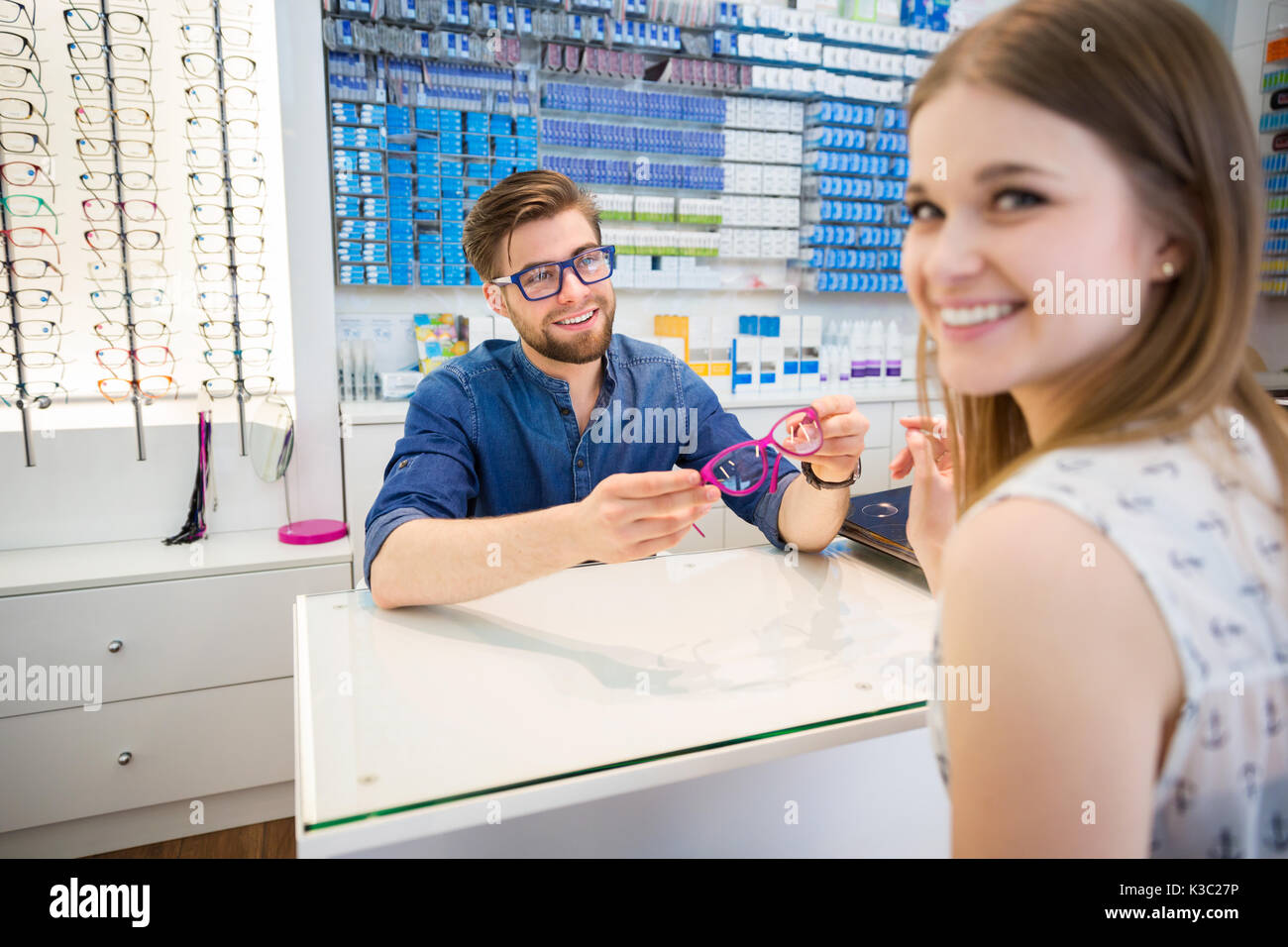 Shop interior with female assistant hi-res stock photography and images ...