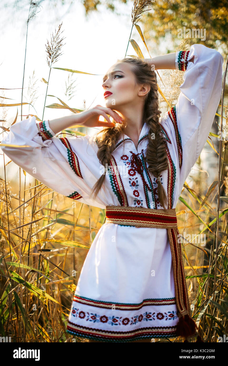 girl wears national belarus clothing posing on summer field Stock Photo ...