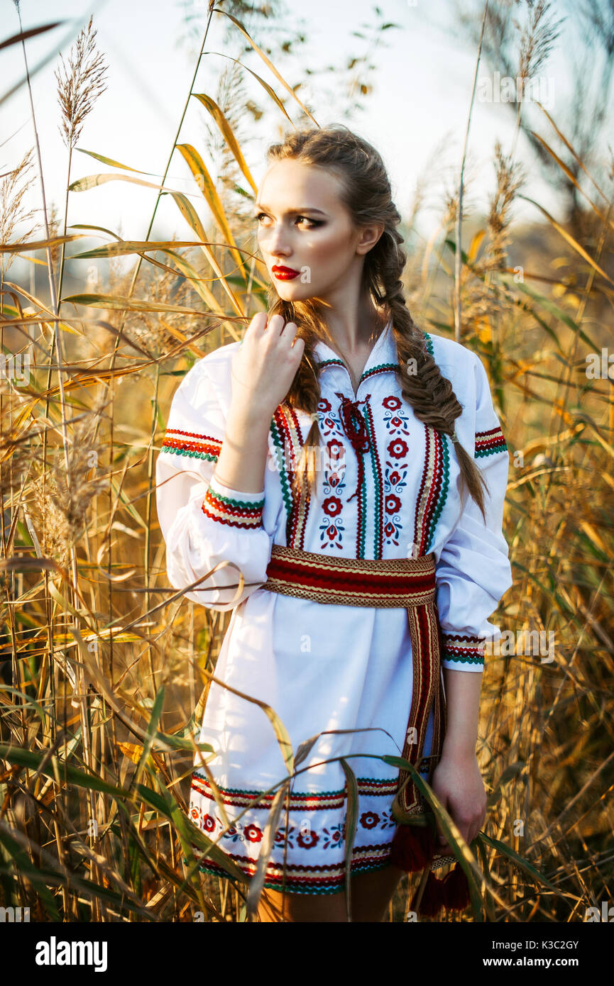 girl wears national belarus clothing posing on summer field Stock Photo ...
