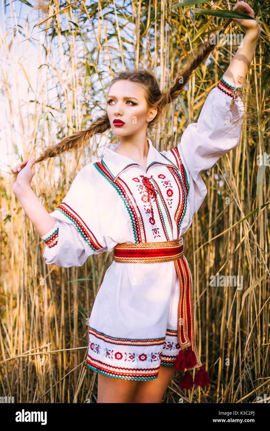 girl wears national belarus clothing posing on summer field Stock Photo ...