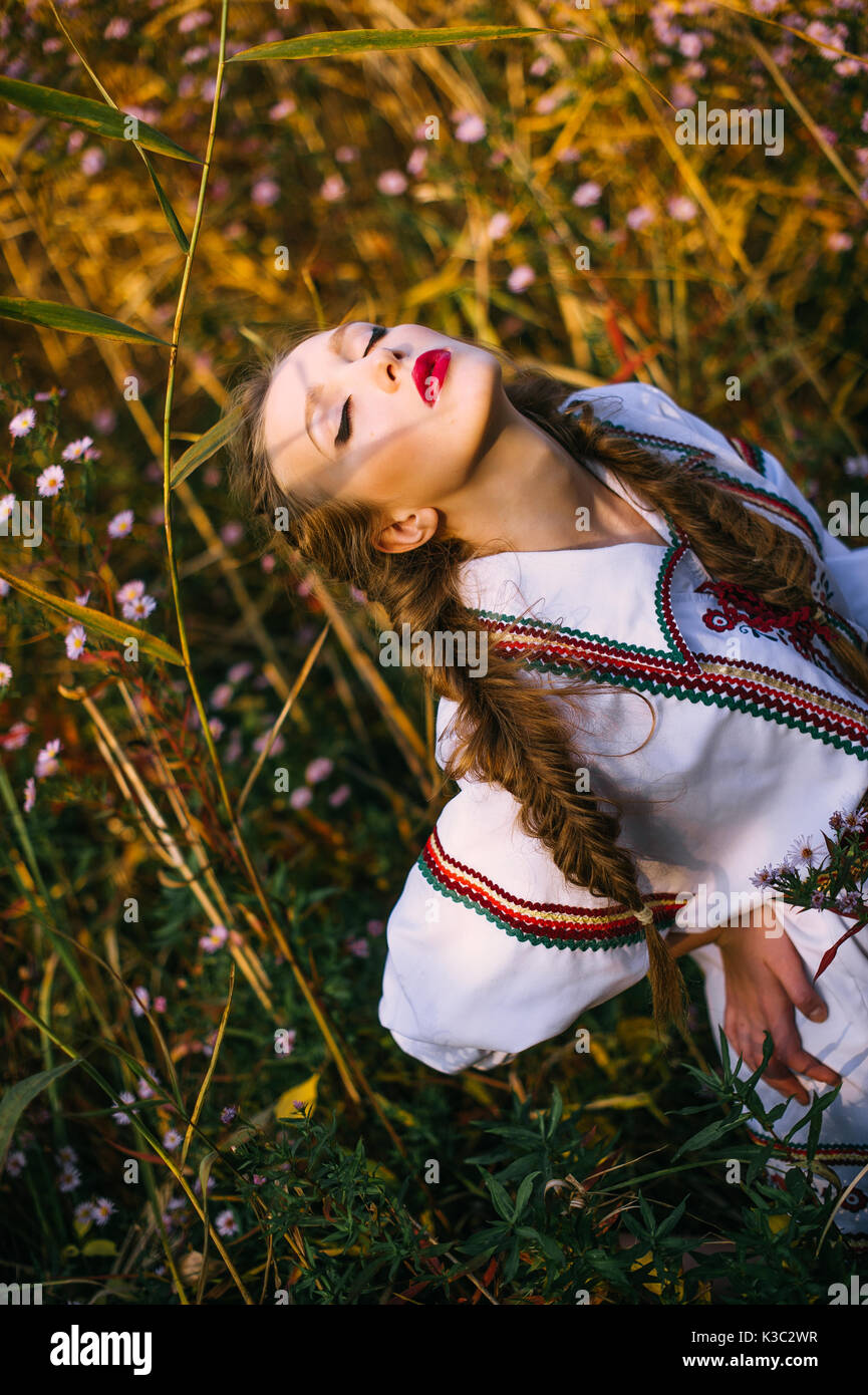girl wears national belarus clothing posing on summer field Stock Photo ...