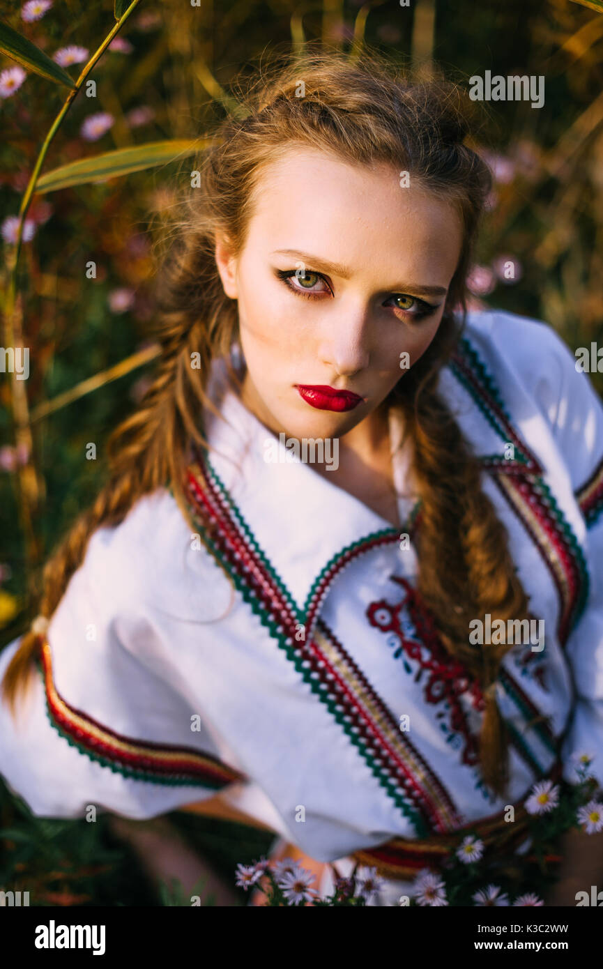girl wears national belarus clothing posing on summer field Stock Photo ...