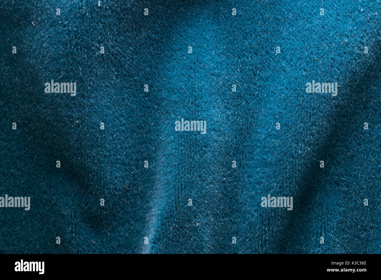 blue velour textile with velvet effect fabric background for fashion ...