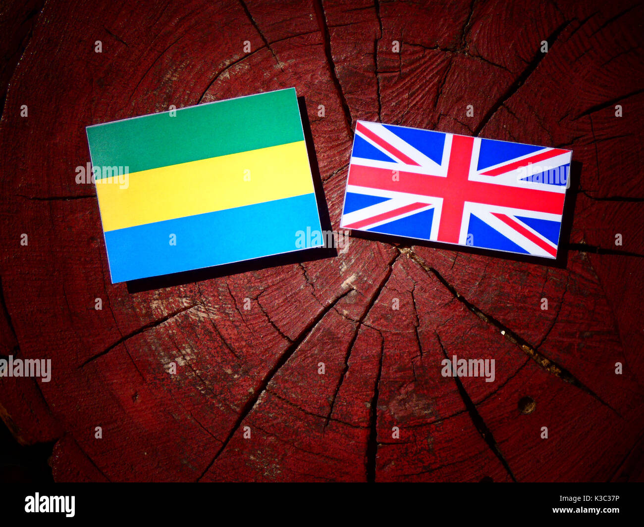 Gabon flag with British flag on a tree stump isolated Stock Photo - Alamy