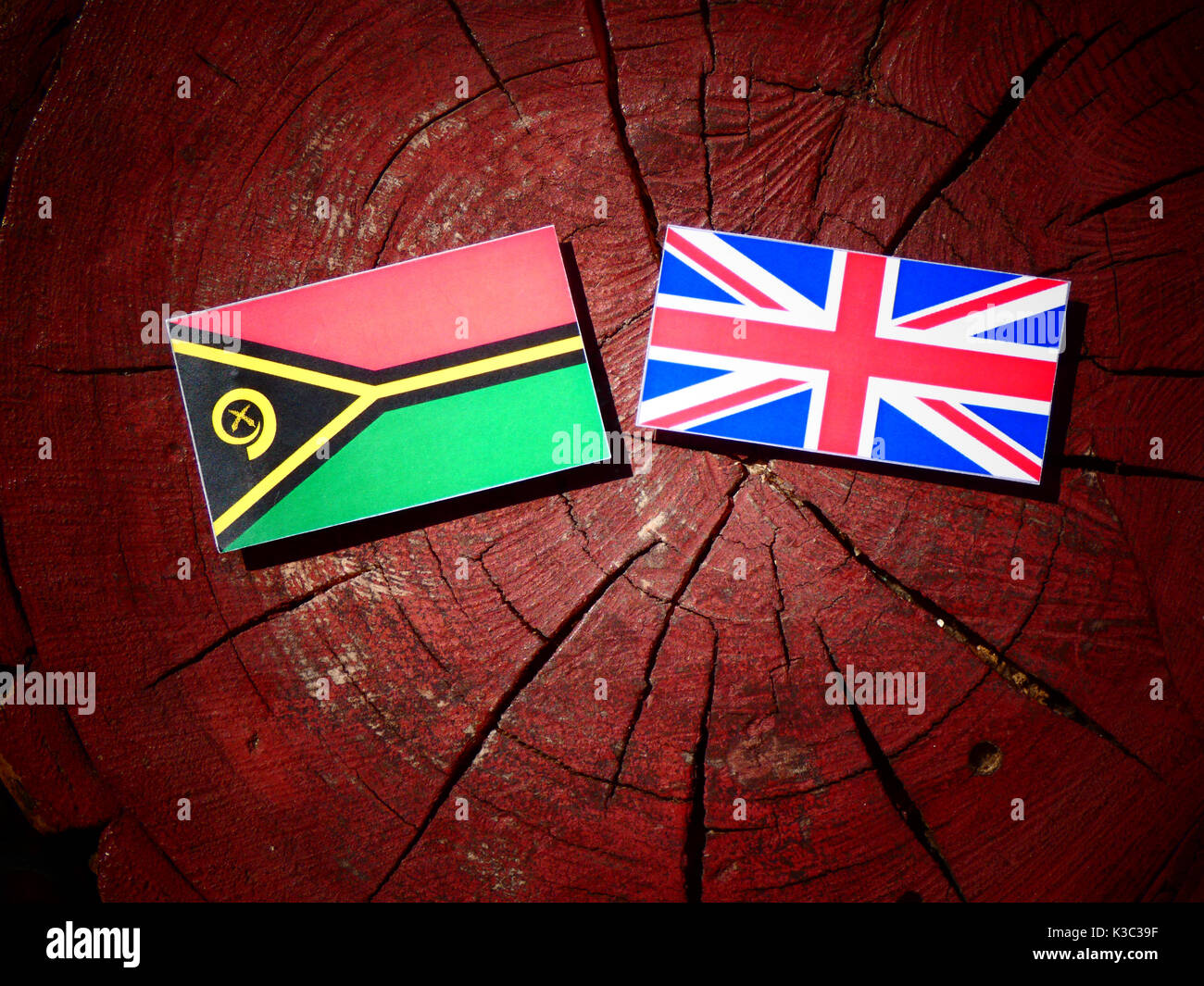 Vanuatu flag with British flag on a tree stump isolated Stock Photo - Alamy