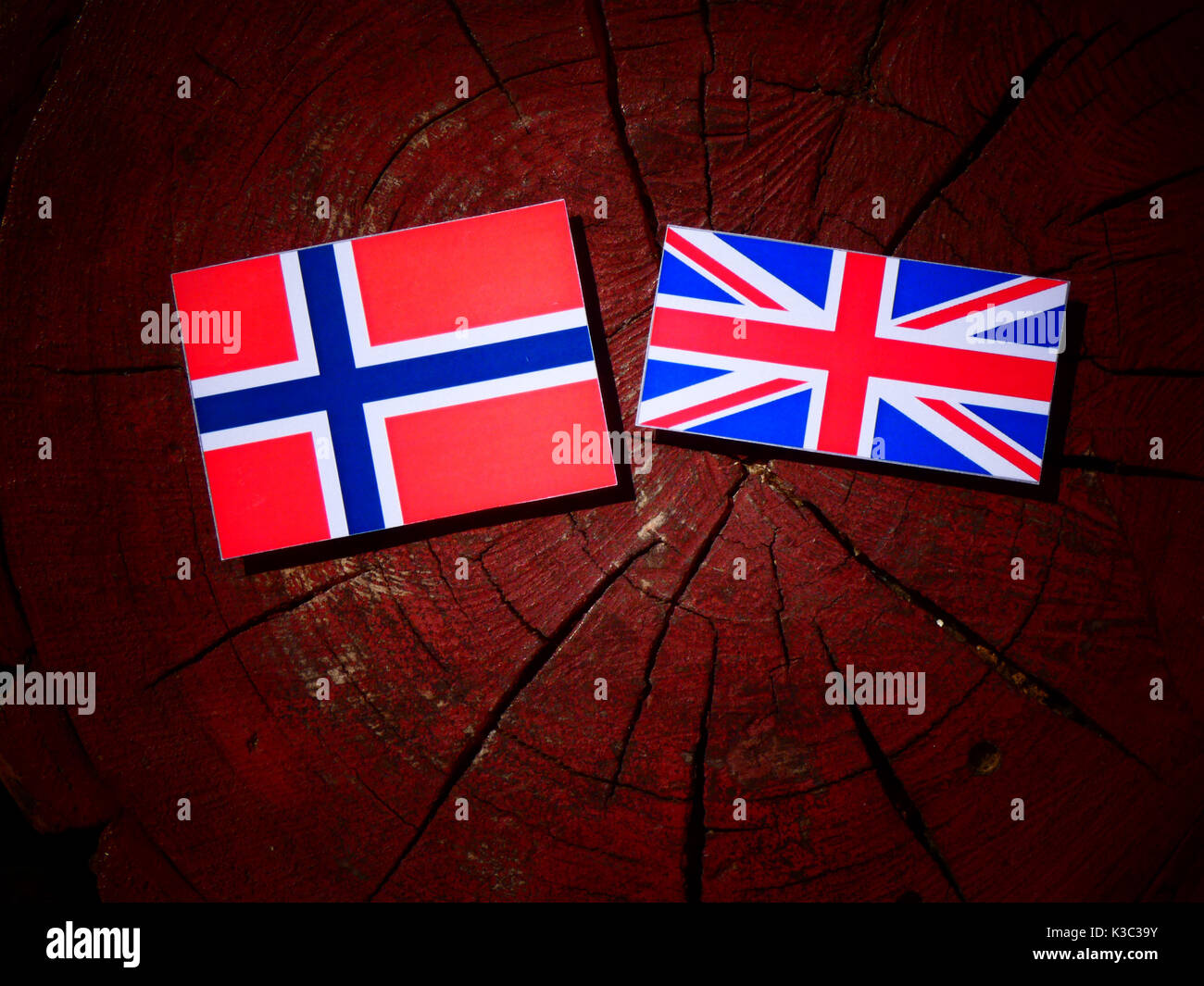 Norwegian flag with British flag on a tree stump isolated Stock Photo ...