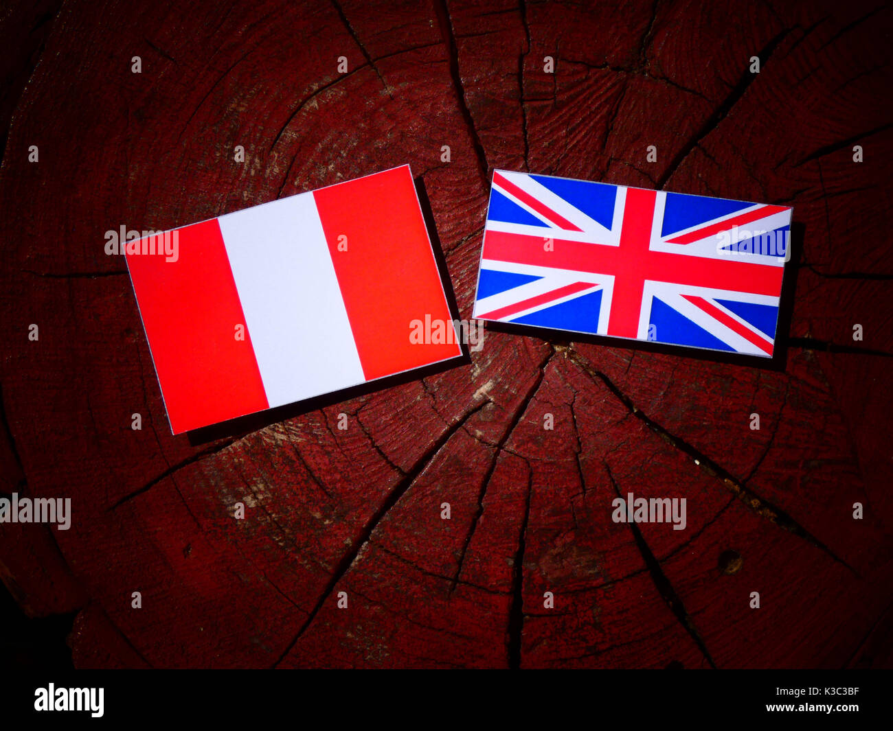Peruvian flag with British flag on a tree stump isolated Stock Photo ...