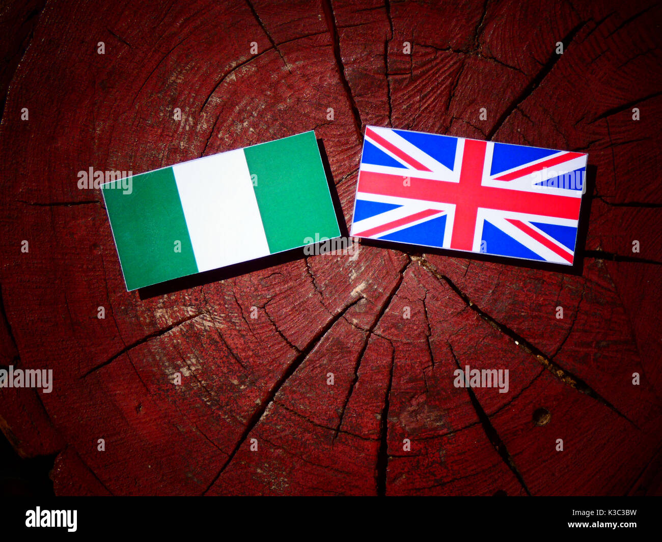 Nigerian flag with British flag on a tree stump isolated Stock Photo ...