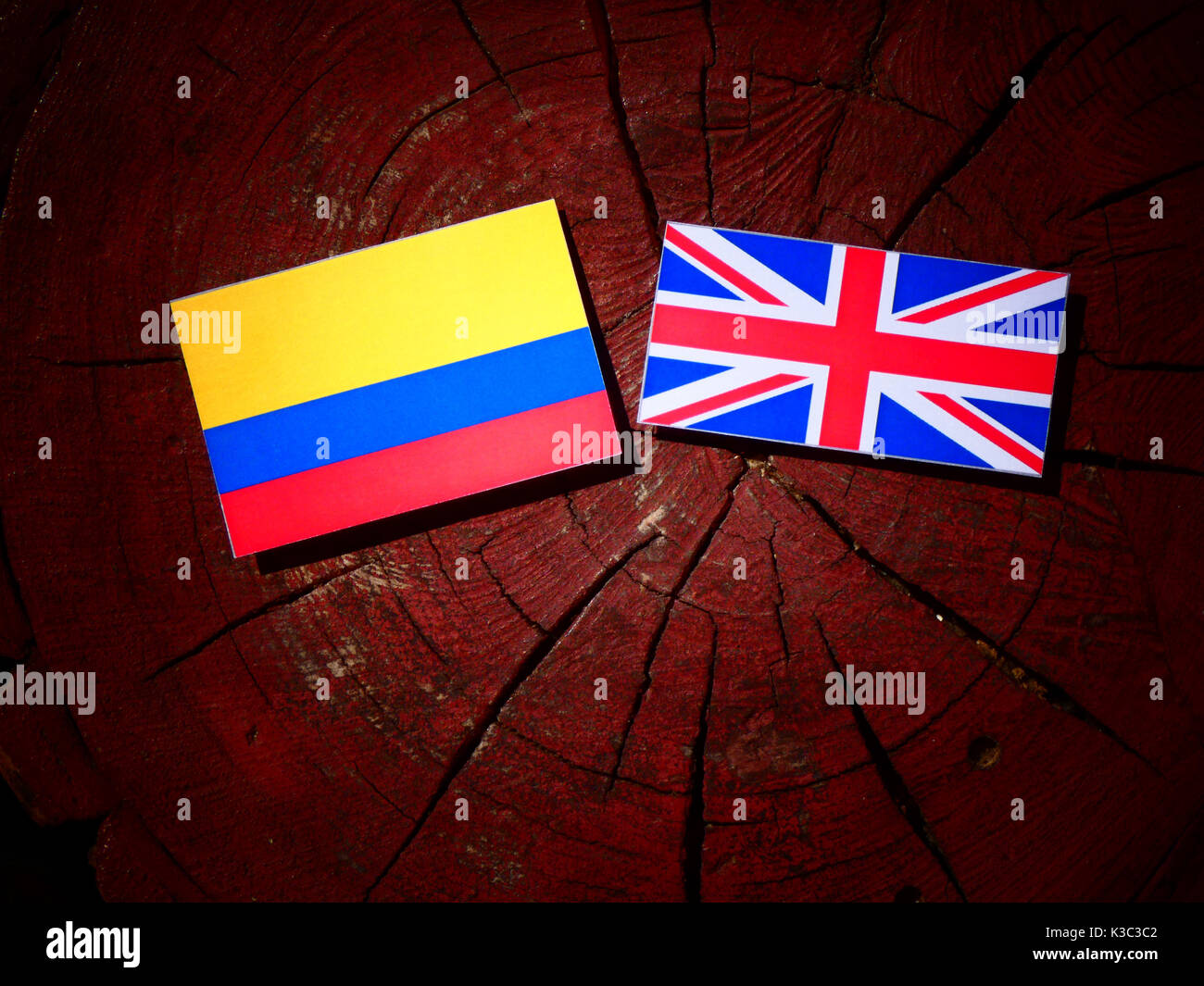 Colombian flag with British flag on a tree stump isolated Stock Photo ...