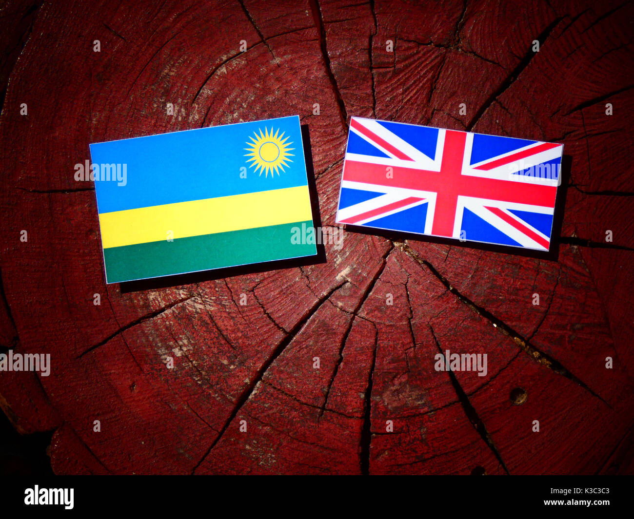 Rwanda flag with British flag on a tree stump isolated Stock Photo - Alamy