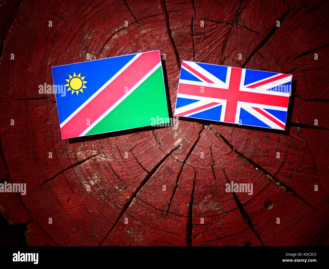 Namibian flag with British flag on a tree stump isolated Stock Photo ...