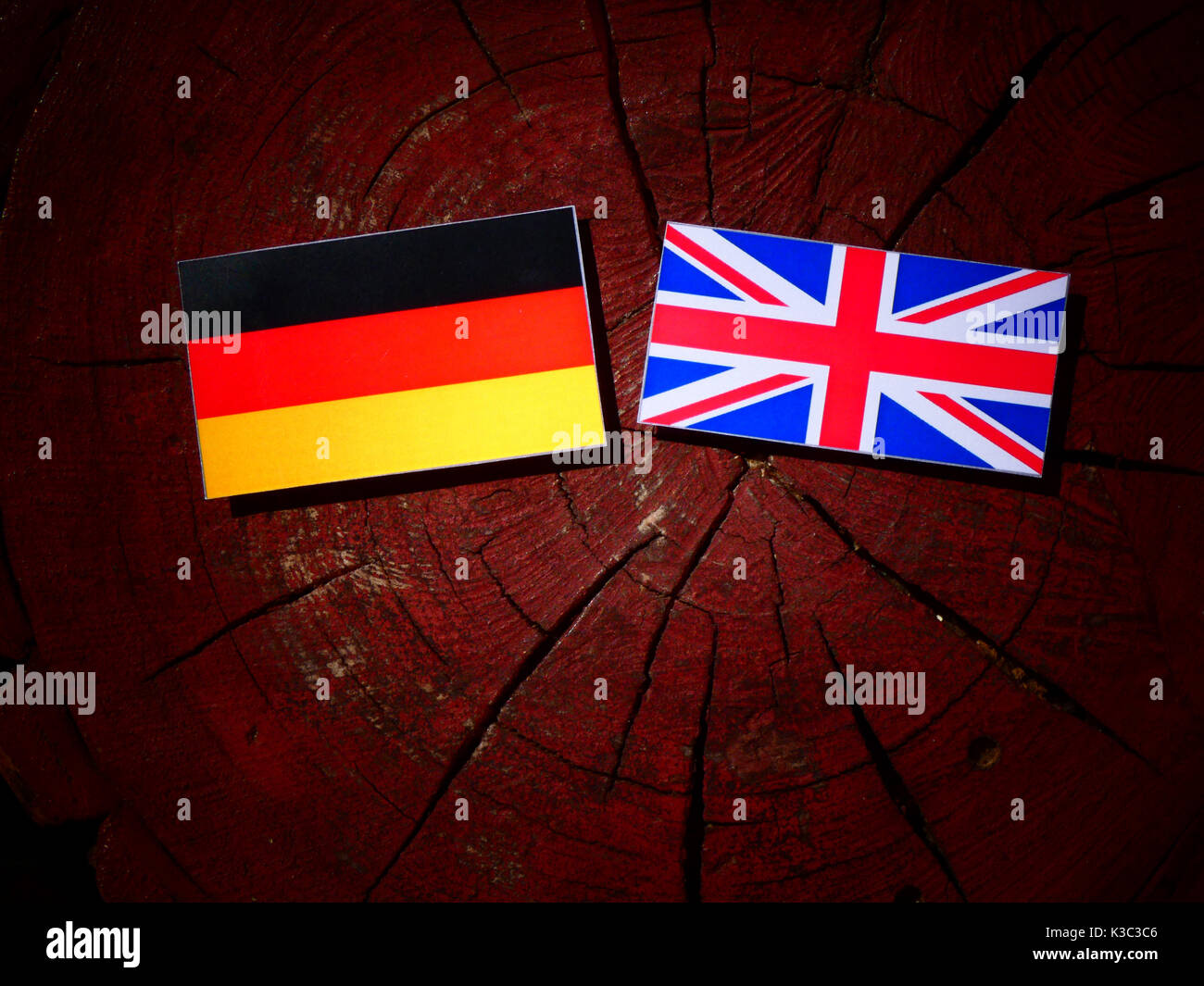 German flag with British flag on a tree stump isolated Stock Photo - Alamy