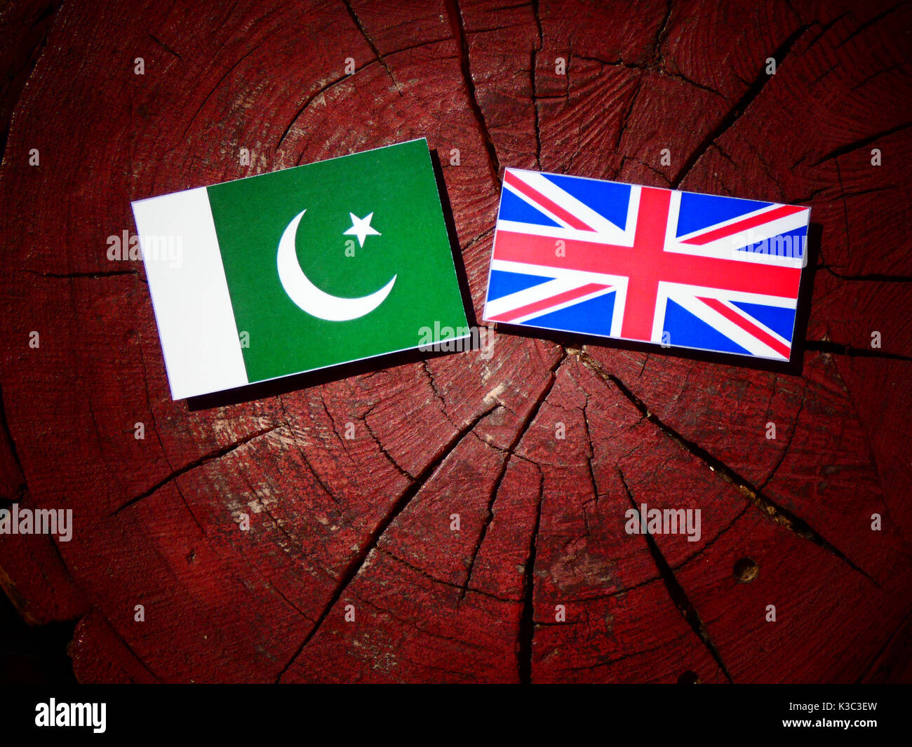 Pakistan flag with British flag on a tree stump isolated Stock Photo ...