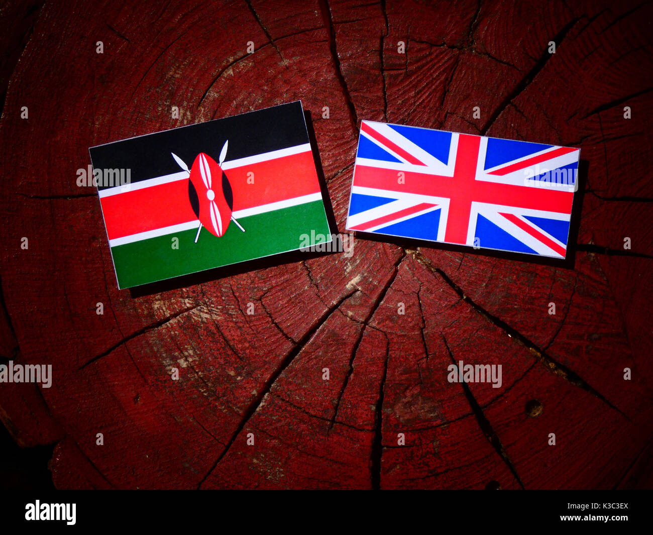 Kenyan flag with British flag on a tree stump isolated Stock Photo - Alamy