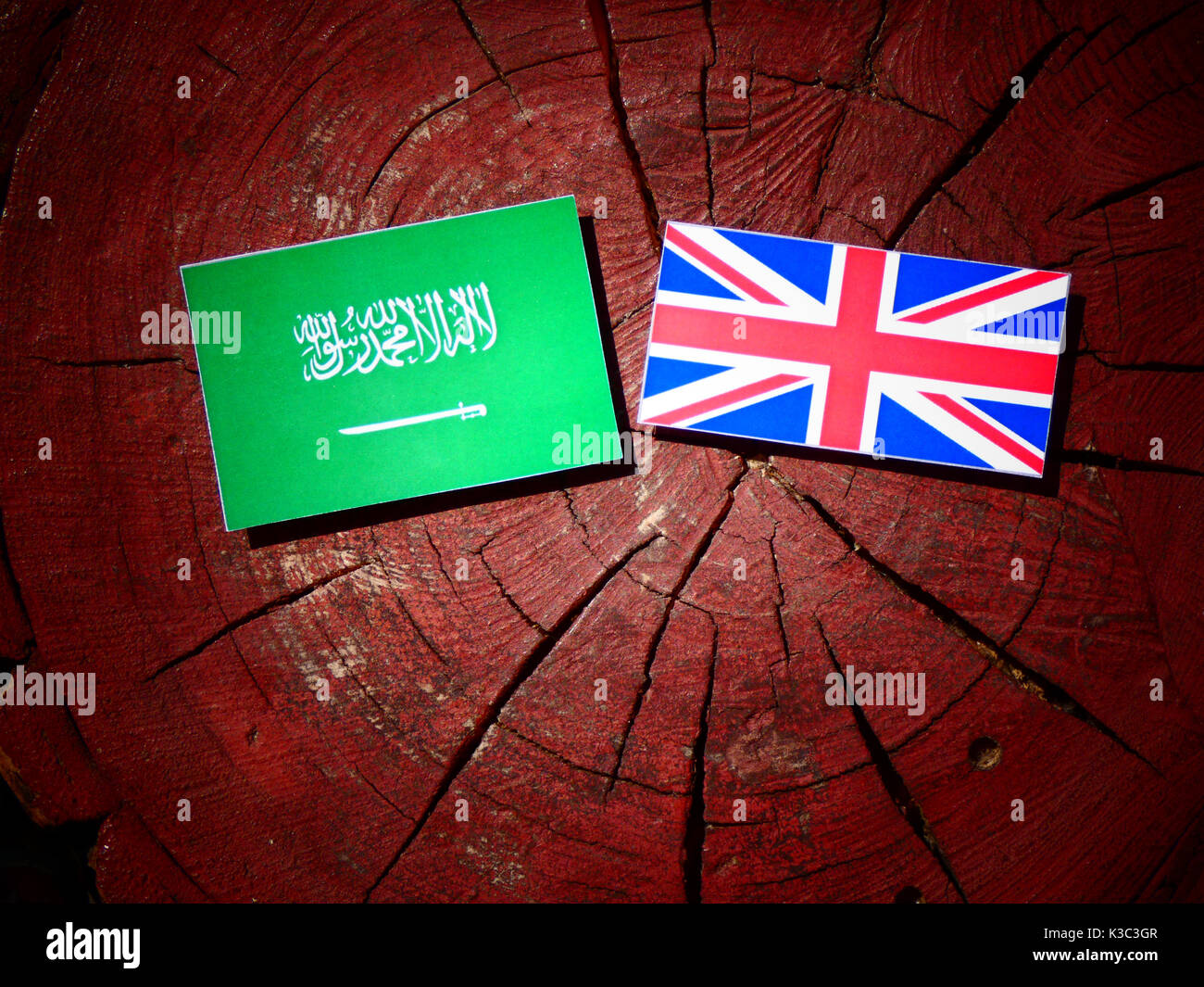 Saudi Arabian flag with British flag on a tree stump isolated Stock ...