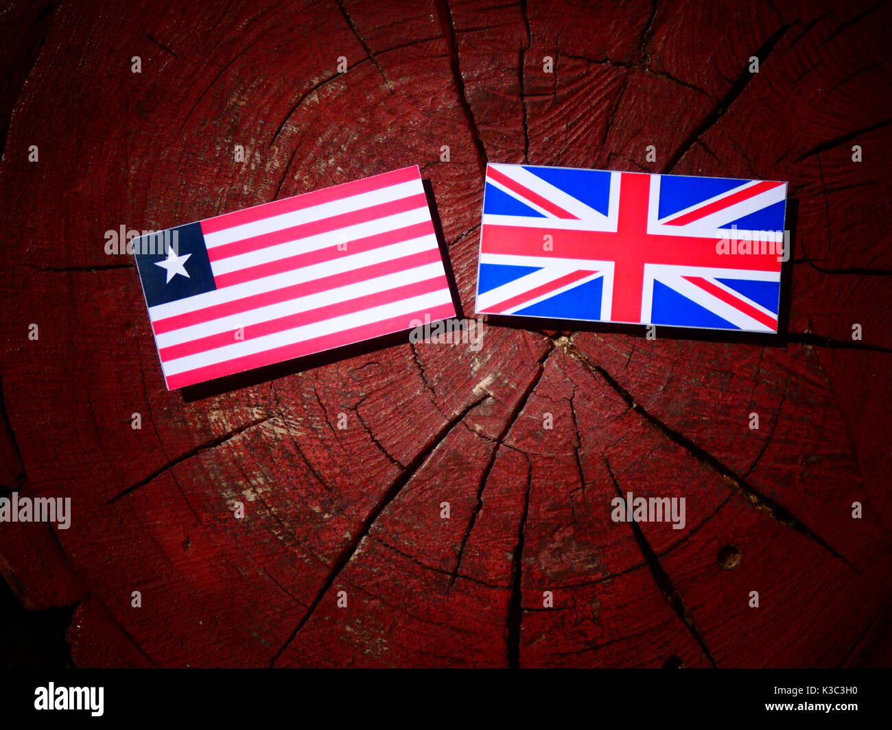 Liberian flag with British flag on a tree stump isolated Stock Photo ...