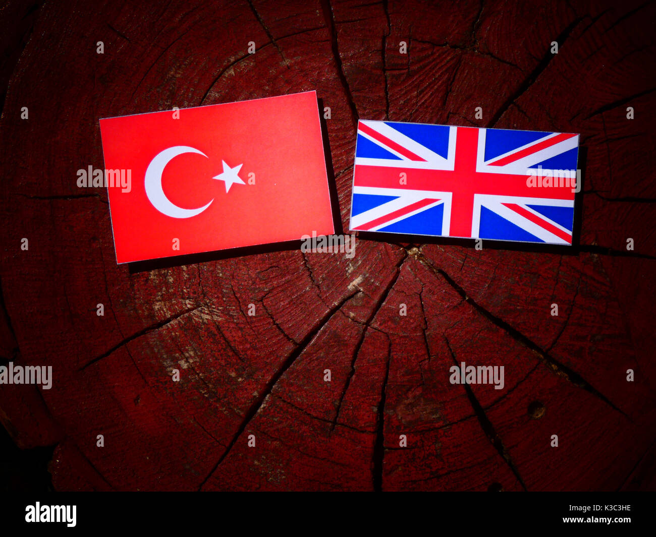 Turkish flag with British flag on a tree stump isolated Stock Photo - Alamy
