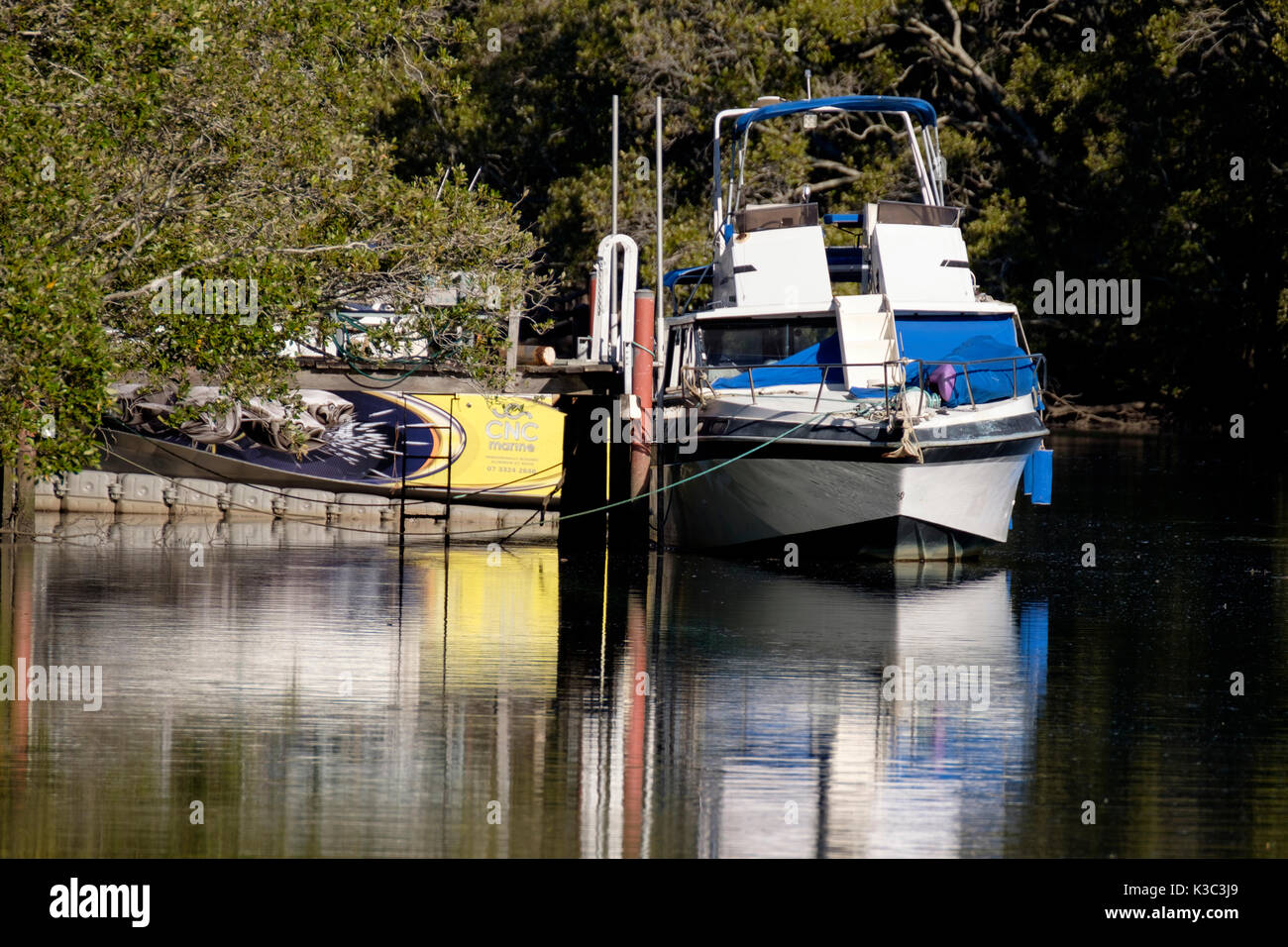 Boats moored on Cabbage Tree Creek Stock Photo - Alamy