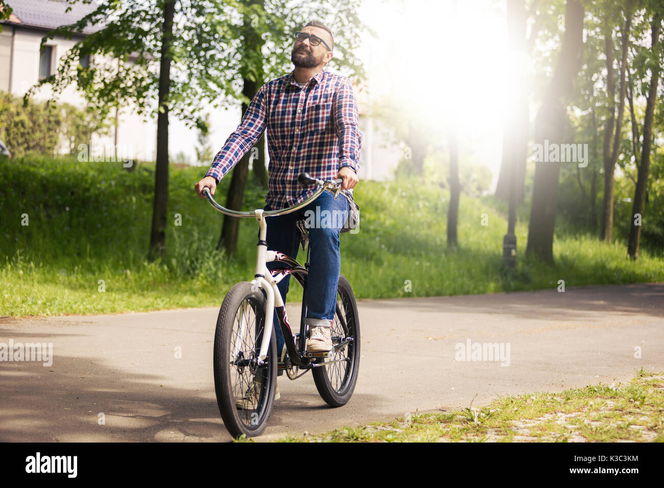 Modern man riding bike hi-res stock photography and images - Alamy