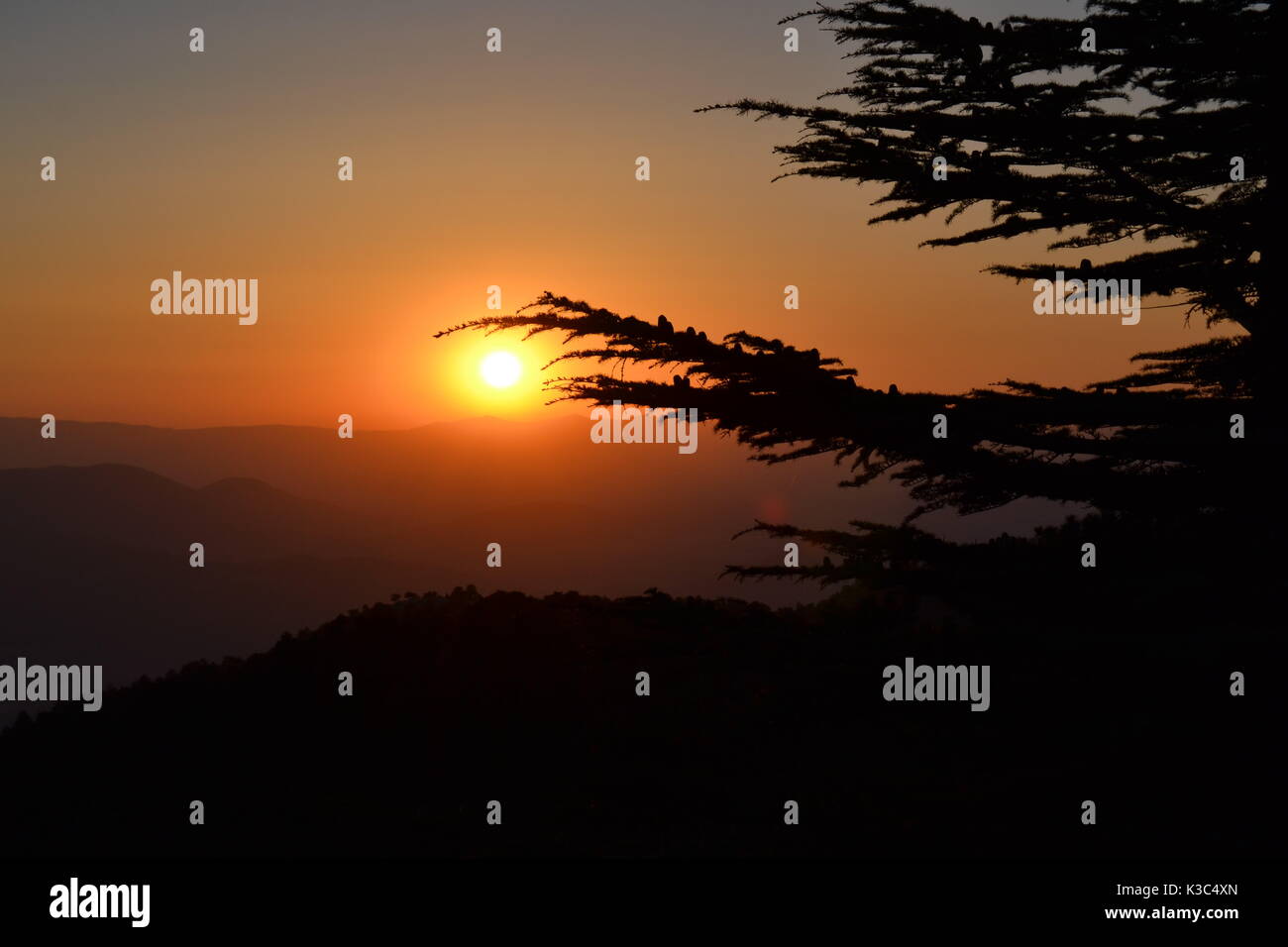 Sunset, Sun goes down, Clouds Stock Photo - Alamy