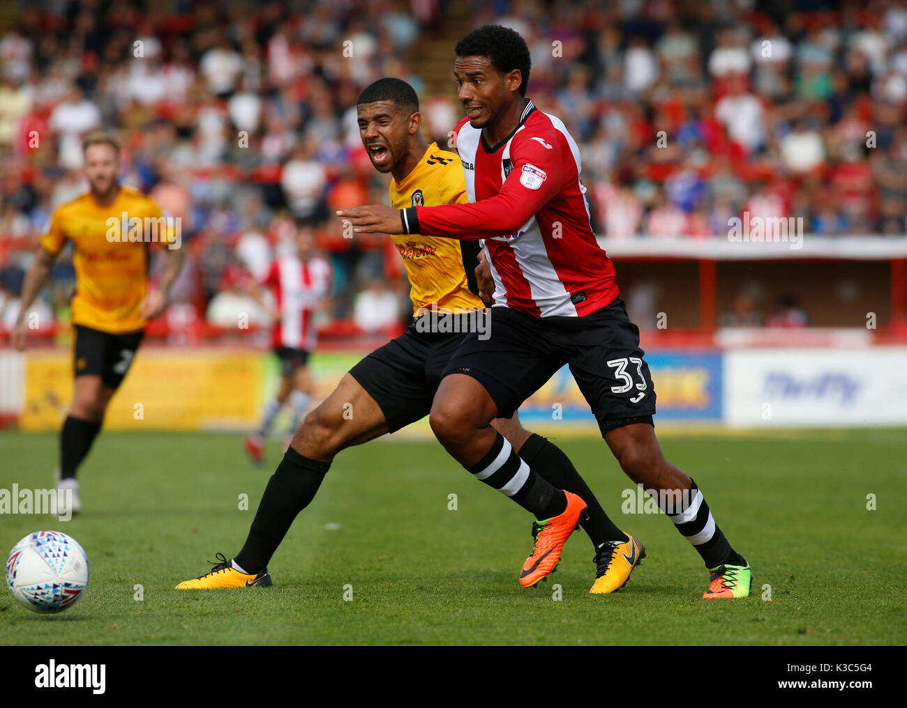 Exeter City's Reuben Reid battles with Newport County's Joss Labadie ...