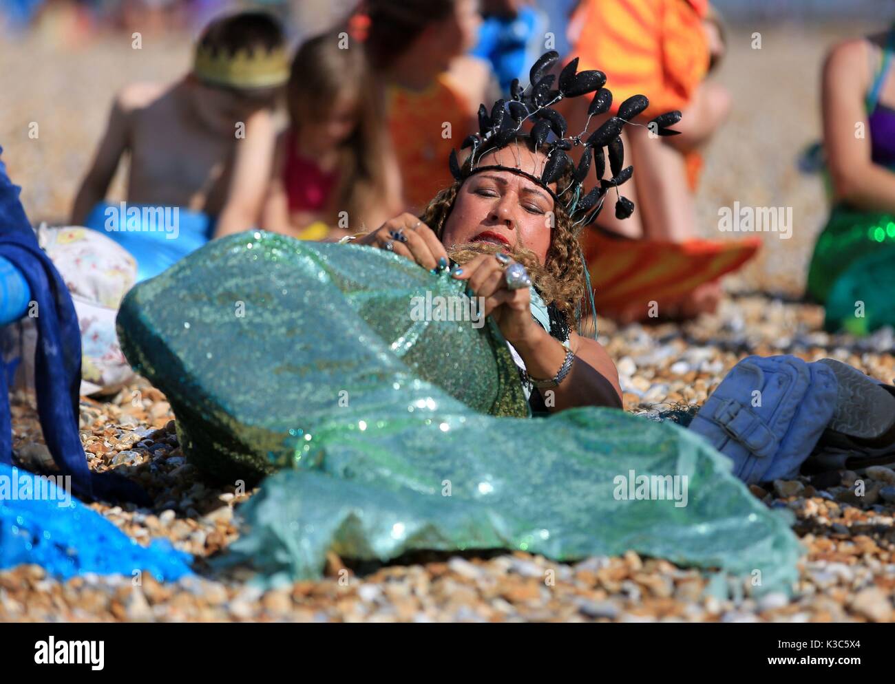 Participants dressed as mermaids gather in Bexhill-on-Sea in East ...