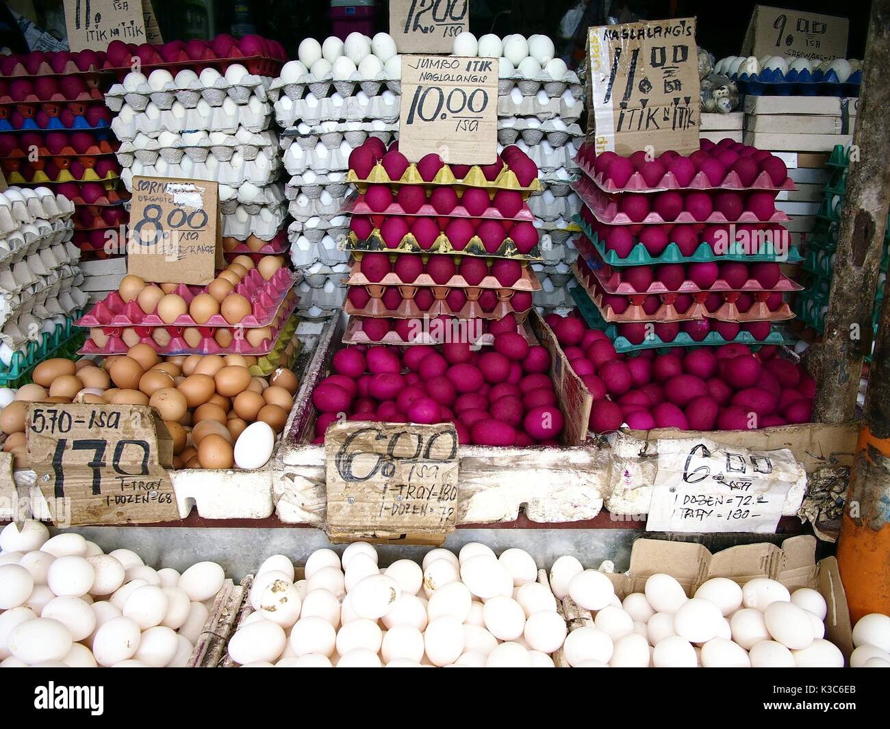 Photo of stacks of trays of eggs on sale at a public market Stock Photo ...