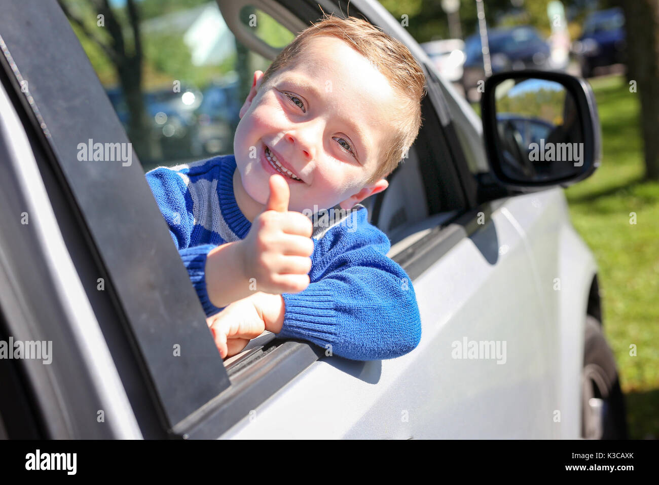 boy look out from the car window Stock Photo - Alamy