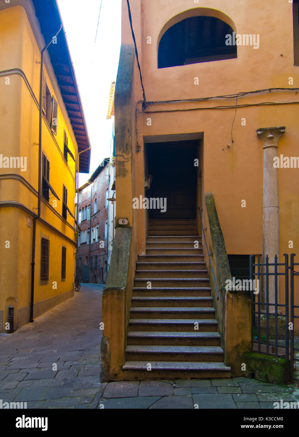 Alley of an ancient hamlet with a historic building with stairs leading ...