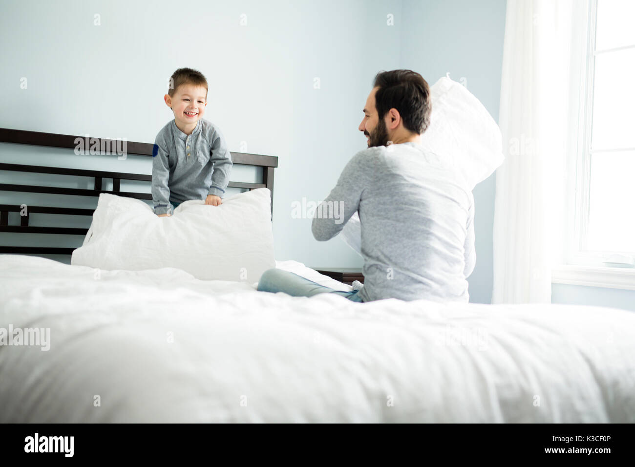 Father and son in bed, happy time on bed Stock Photo - Alamy