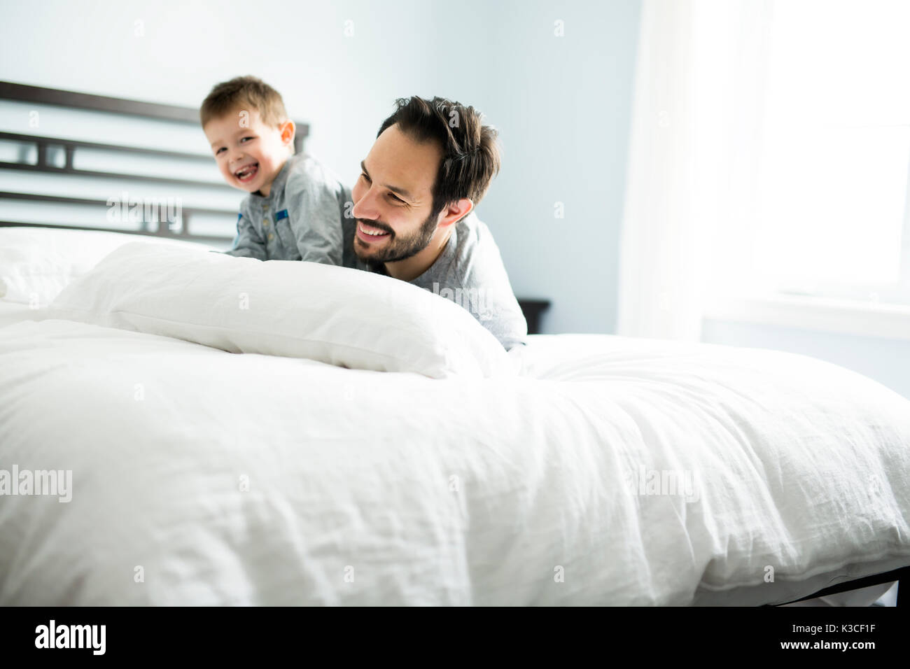 Father and son in bed, happy time on bed Stock Photo - Alamy