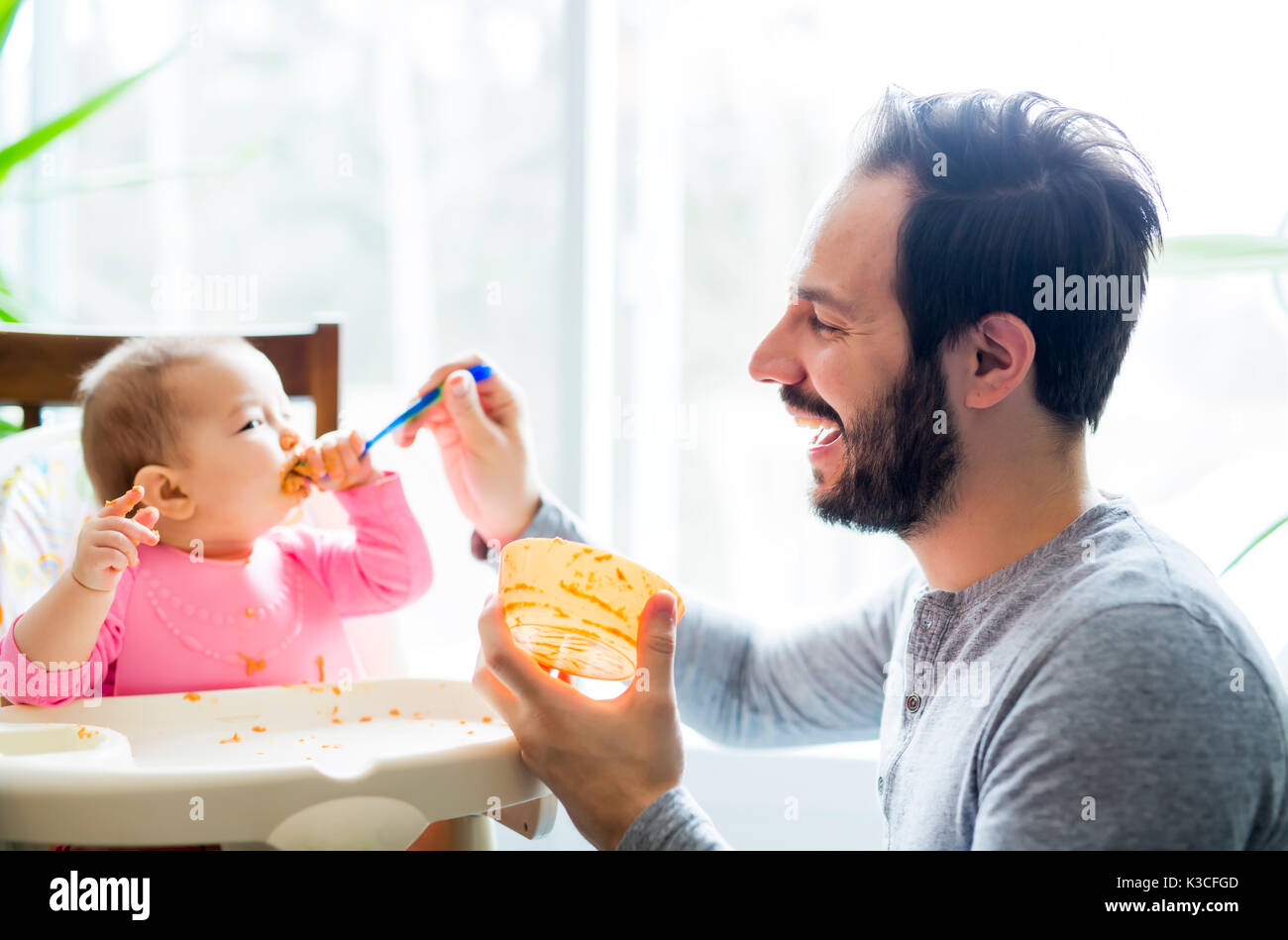 father feeding his little baby daughter Stock Photo - Alamy