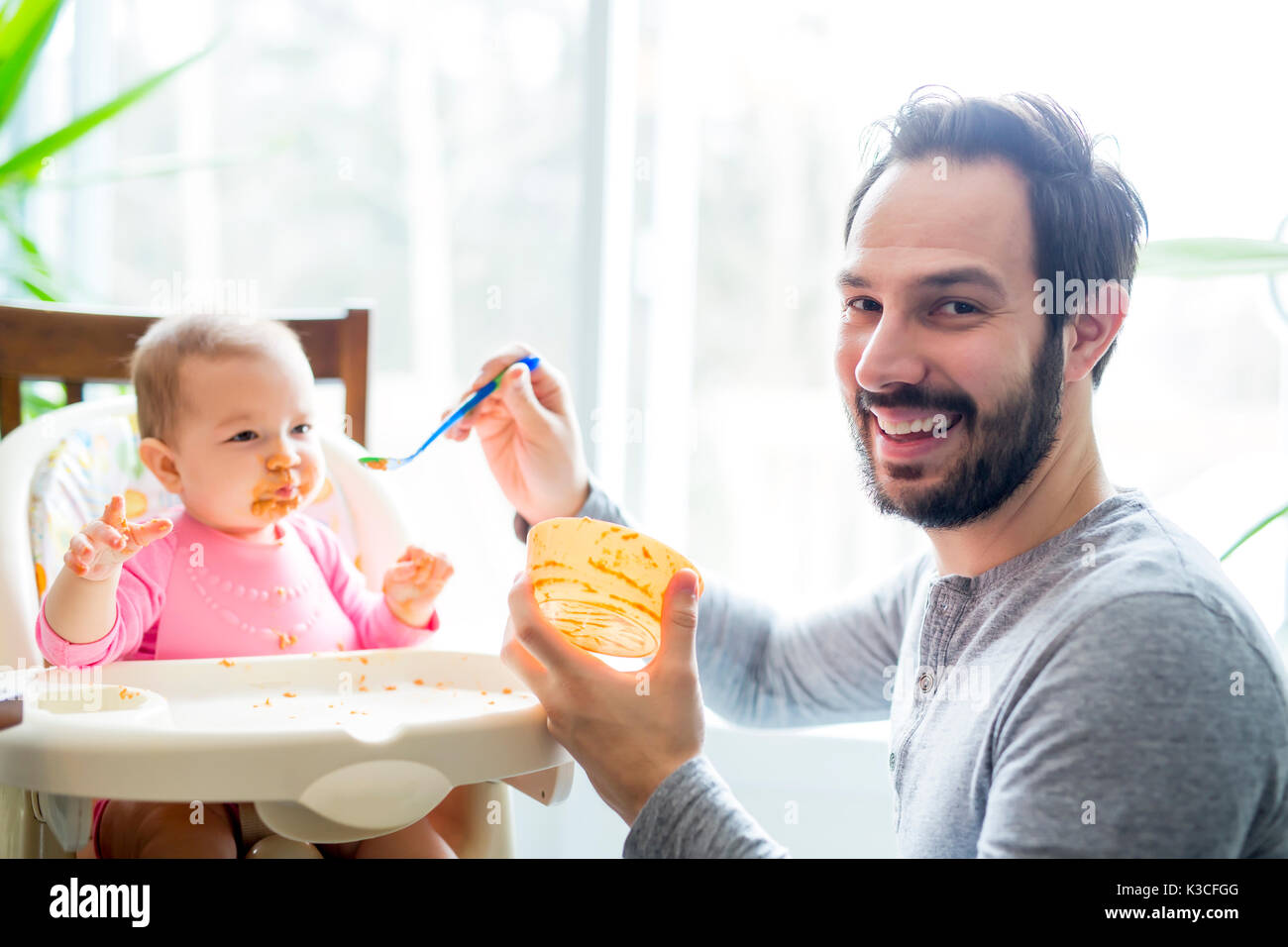 father feeding his little baby daughter Stock Photo - Alamy