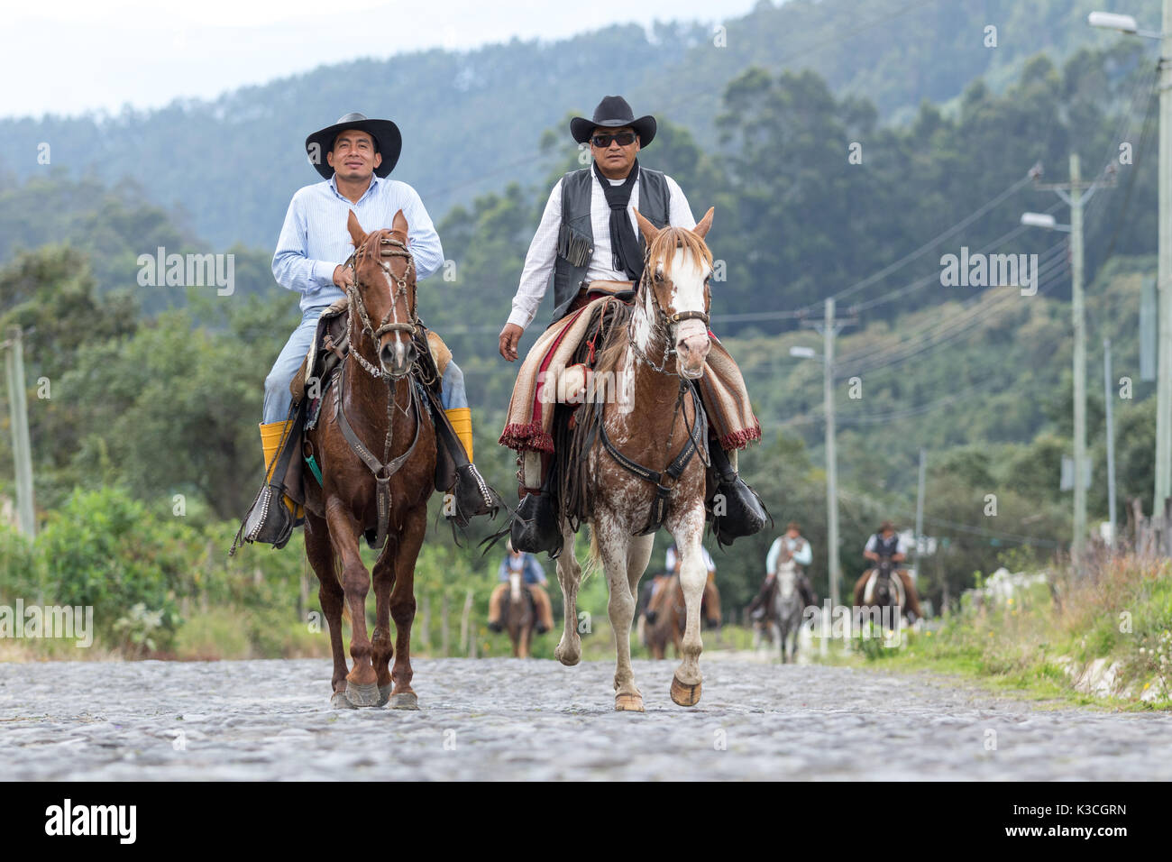 May 27, 2017 Sangolqui, Ecuador: cowboys arriving on horse back on a ...