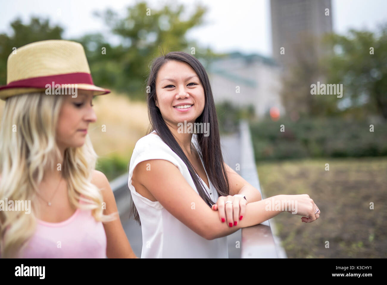 two beautiful young women having fun in the city Stock Photo - Alamy