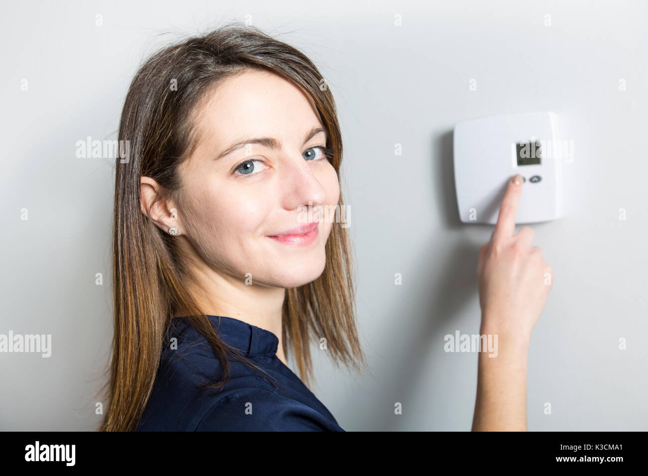 woman set the thermostat at home Stock Photo - Alamy