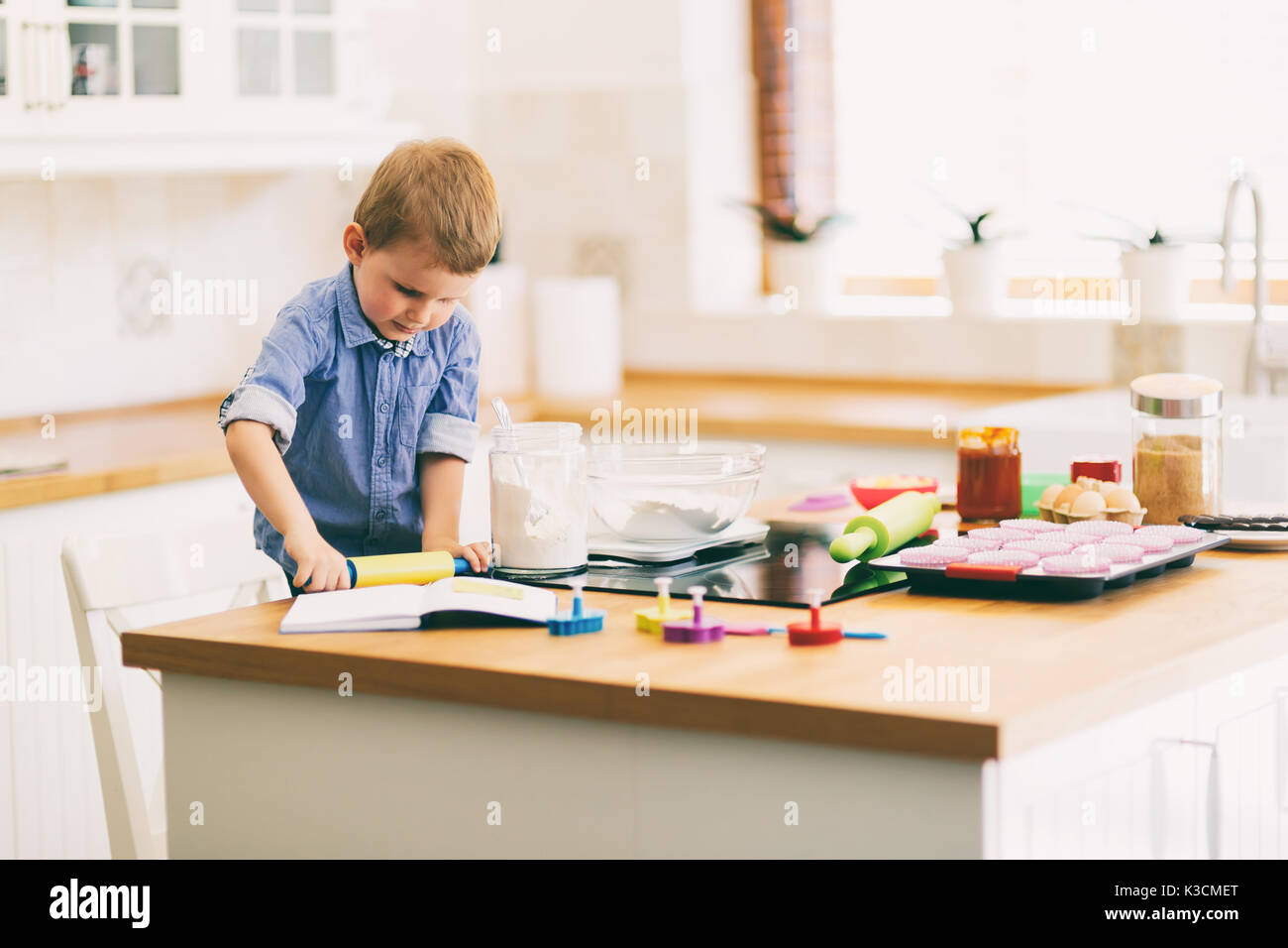 Cute child learning to become a chef Stock Photo - Alamy