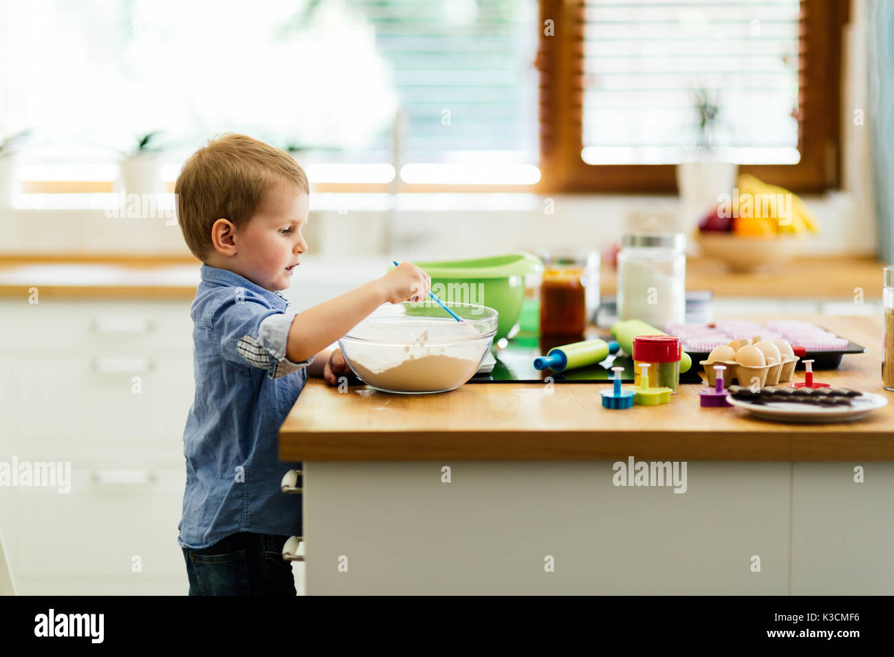 Cute child learning to become a chef Stock Photo - Alamy