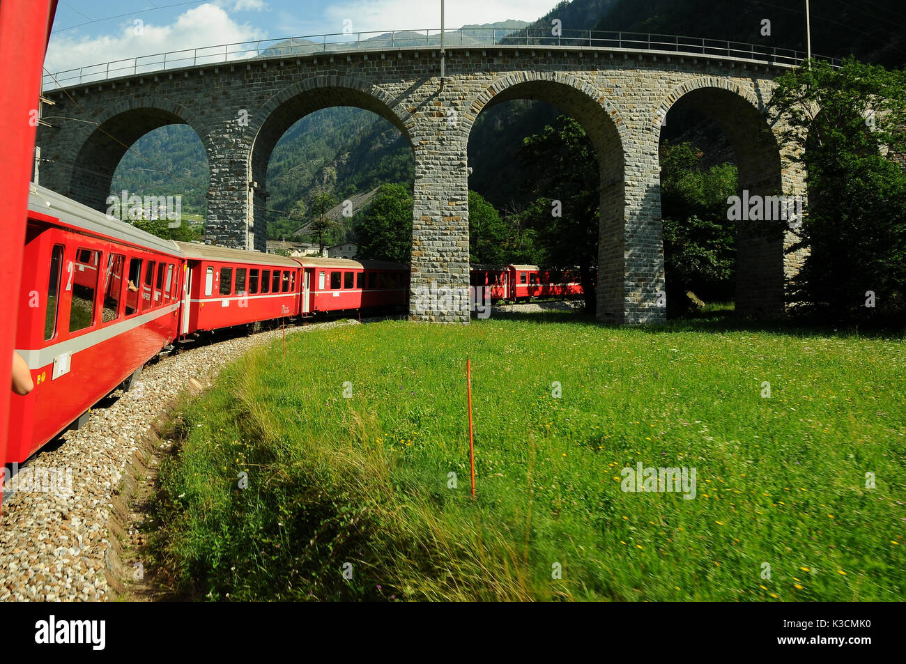 Swiss Red Train Bernina Express pass on Brusio Viaduct, Italy ...