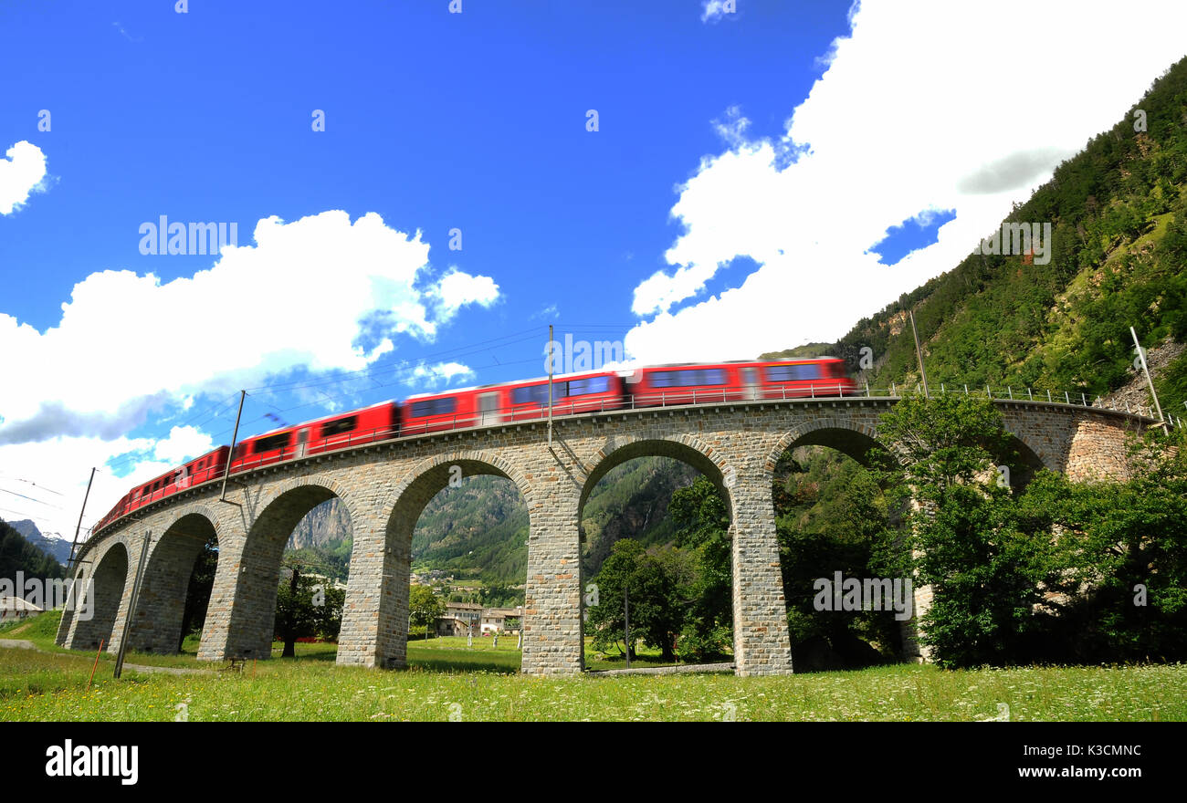 Swiss Red Train Bernina Express pass on Brusio Viaduct, Italy ...