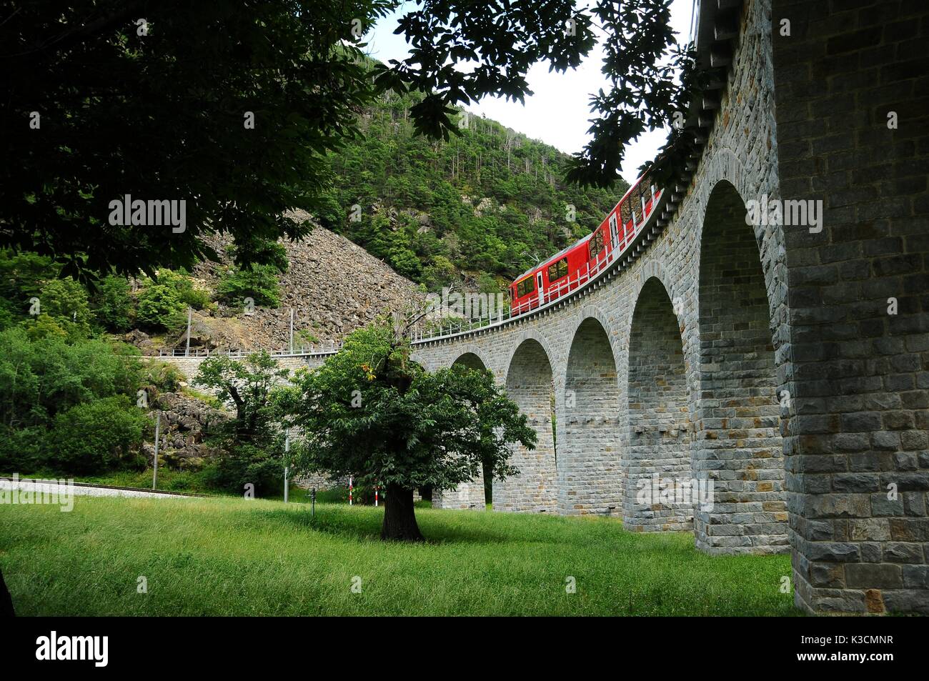 Swiss Red Train Bernina Express pass on Brusio Viaduct, Italy ...